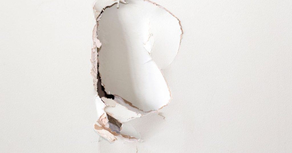 How to fix hole in drywall wall - craftingwithconcrete.com