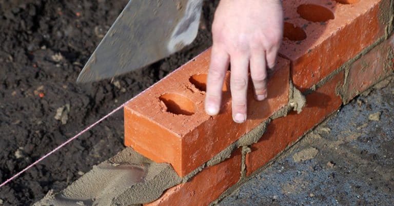 How to lay brick wall on concrete - craftingwithconcrete.com