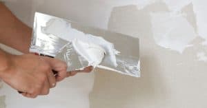How to skim coat a wall for beginners - craftingwithconcrete.com