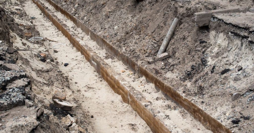 Can you pour concrete over utility lines? - craftingwithconcrete.com