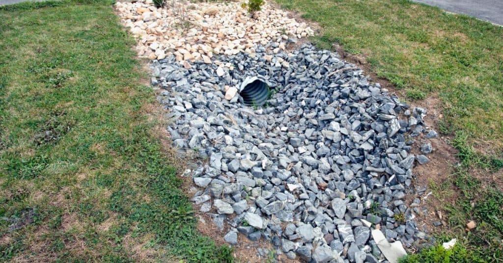 How to build a drainage ditch - craftingwithconcrete.com