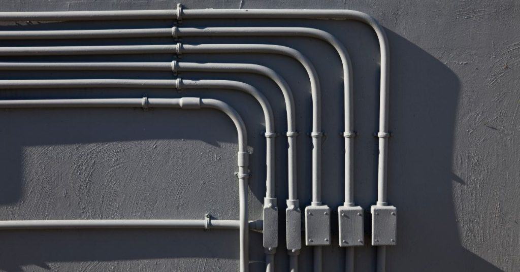 How to run conduit through exterior wall - craftingwithconcrete.com