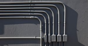 How to run conduit through exterior wall - craftingwithconcrete.com