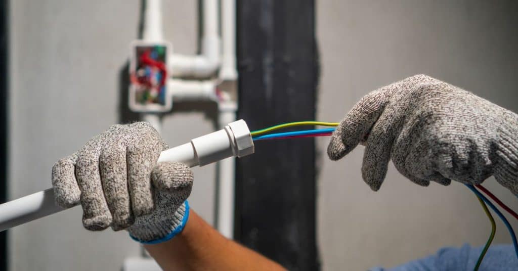 How to run conduit through exterior wall - craftingwithconcrete.com